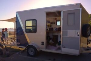Amazing cargo trailer conversion into surfer’s toy hauler RV