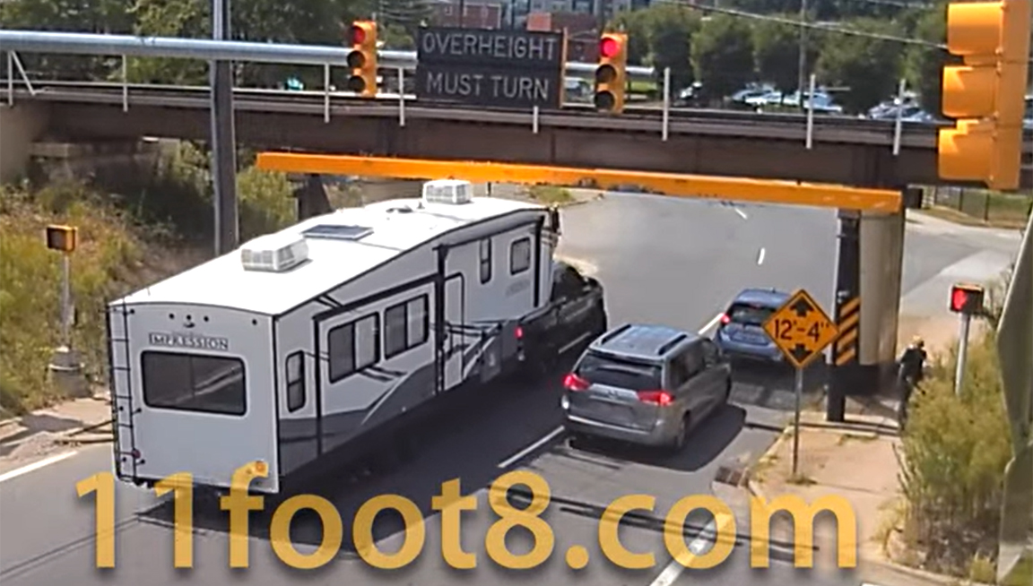RVer drives under low bridge. Oops! Not pretty